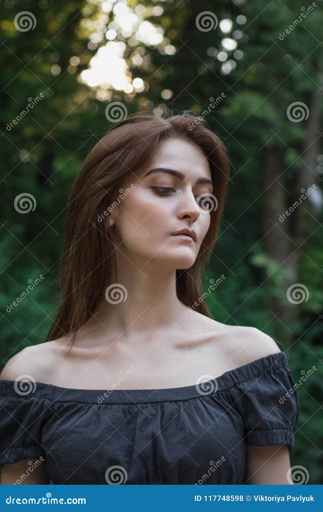 Closeup Shot Of Beautiful Brunette Model Wearing Dress With Naked