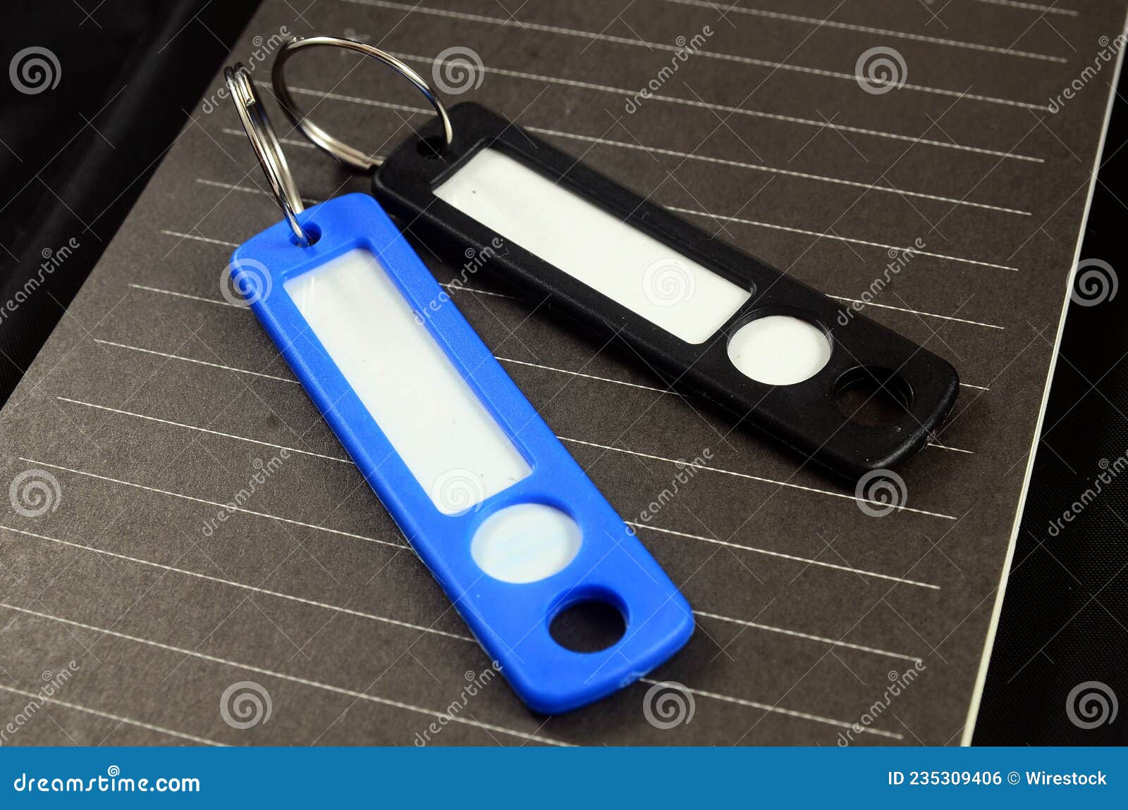 Closeup Shot of Black and Blue Plastic Tag Labels on a Dark Surface ...
