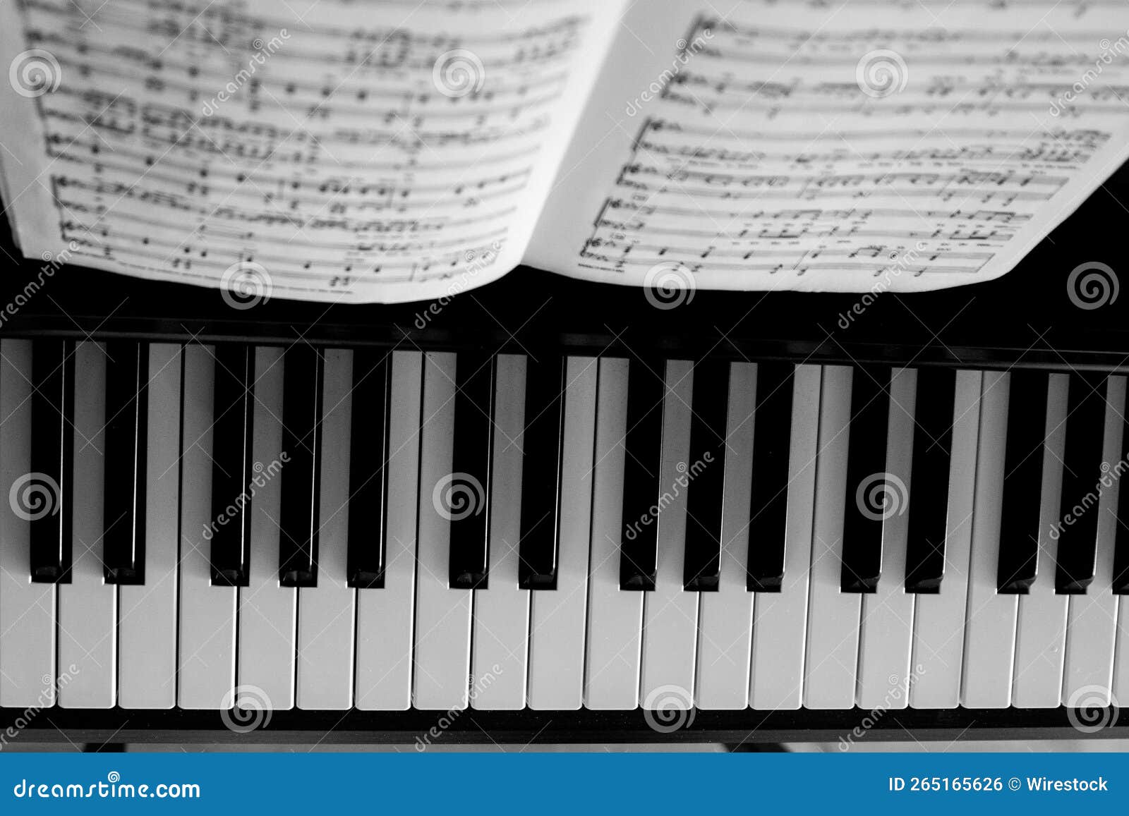 Closeup Shot of a Black Piano with Music Notes Stock Photo - Image of ...