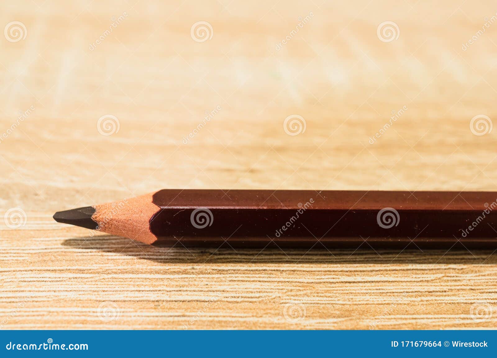 Closeup Shot of a Brown Pencil on a Wooden Surface Stock Photo - Image ...