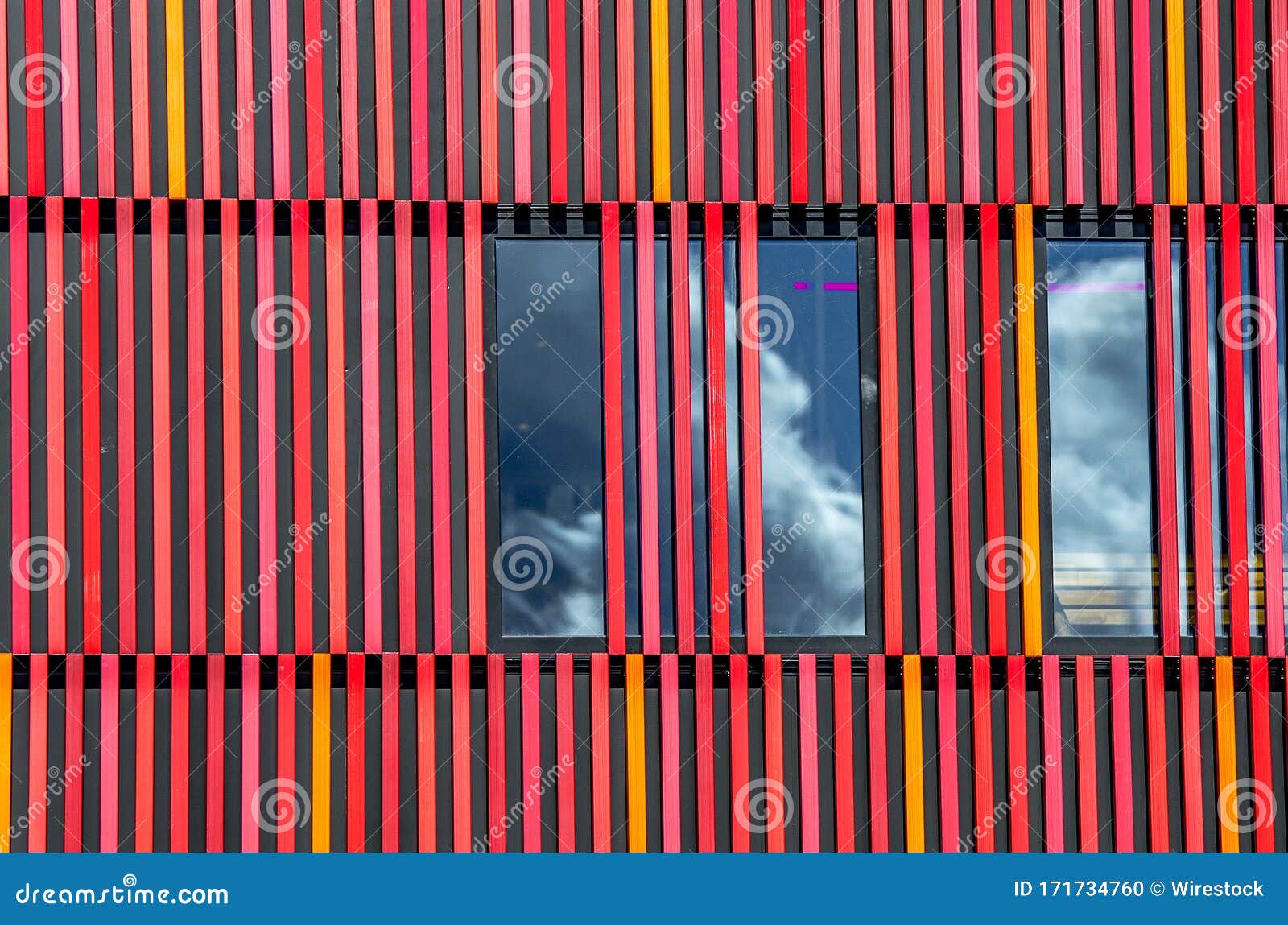Closeup Shot of a Building with Tall Windows and a Unique Striped ...