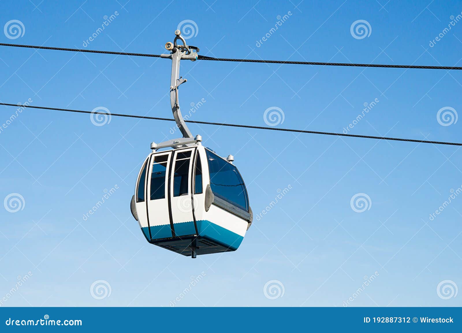 Closeup Shot of a Cable Car on a Ropeway with a Blue Sky Background ...
