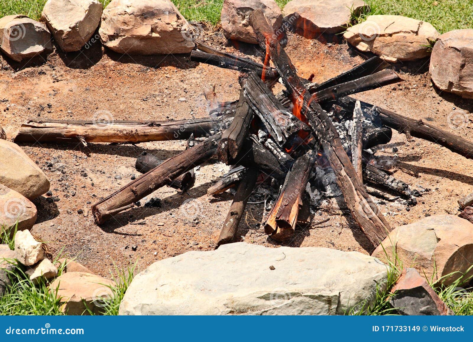 Closeup Shot of a Campfire Surrounded by Rocks during the Day Stock ...