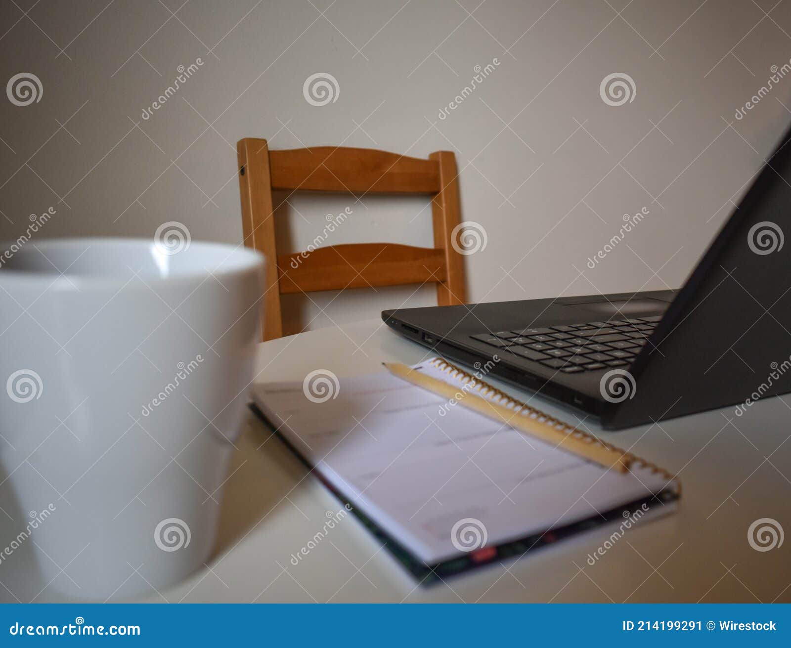 Closeup Shot of a Chair and Table with a Laptop and Notes Stock Image ...