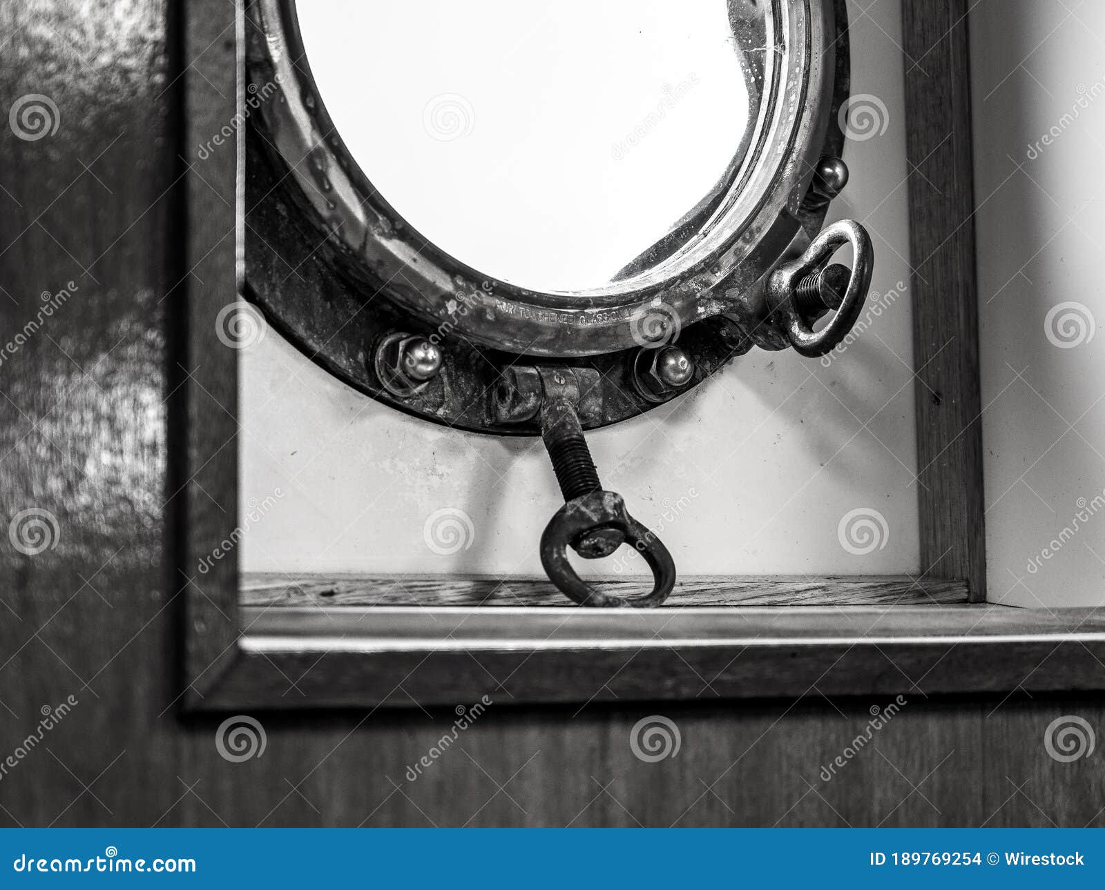 Closeup Shot of a Circular Window of a Ship with Thick Metal Frames ...