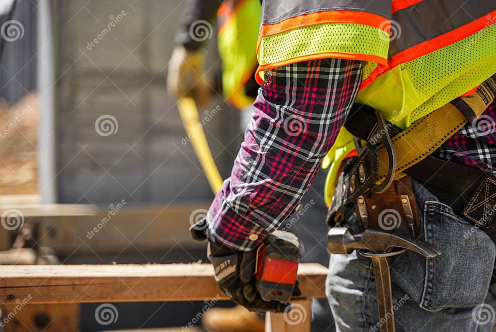 Closeup Shot of a Construction Worker Measuring the Distance from a ...