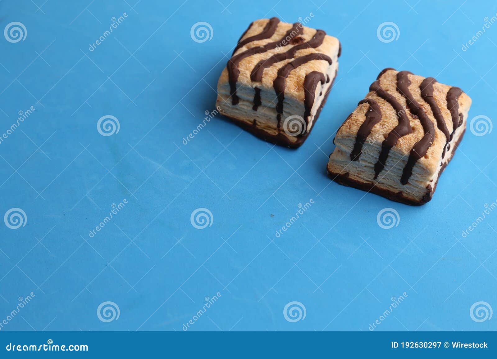 Closeup Shot of Delicious Square Biscuits with Chocolate Cream on a ...