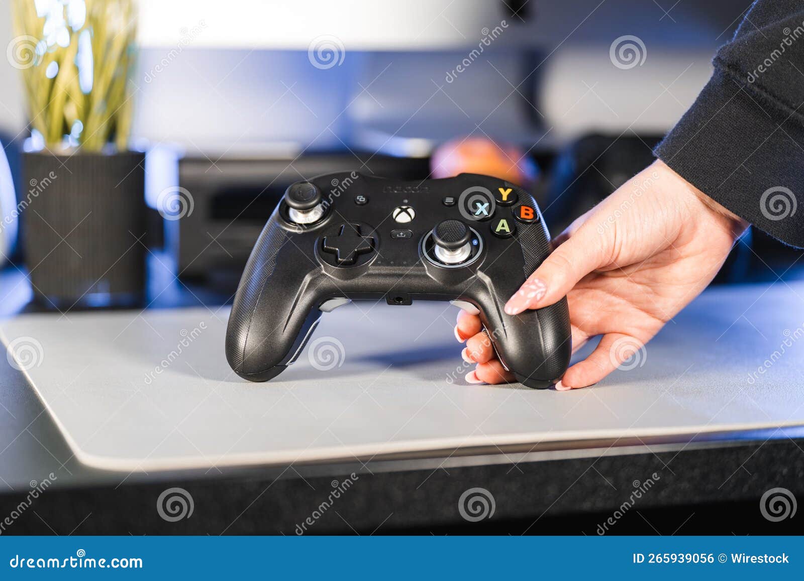 Closeup Shot of a Female S Hand Showing a Black Xbox Controller on a ...