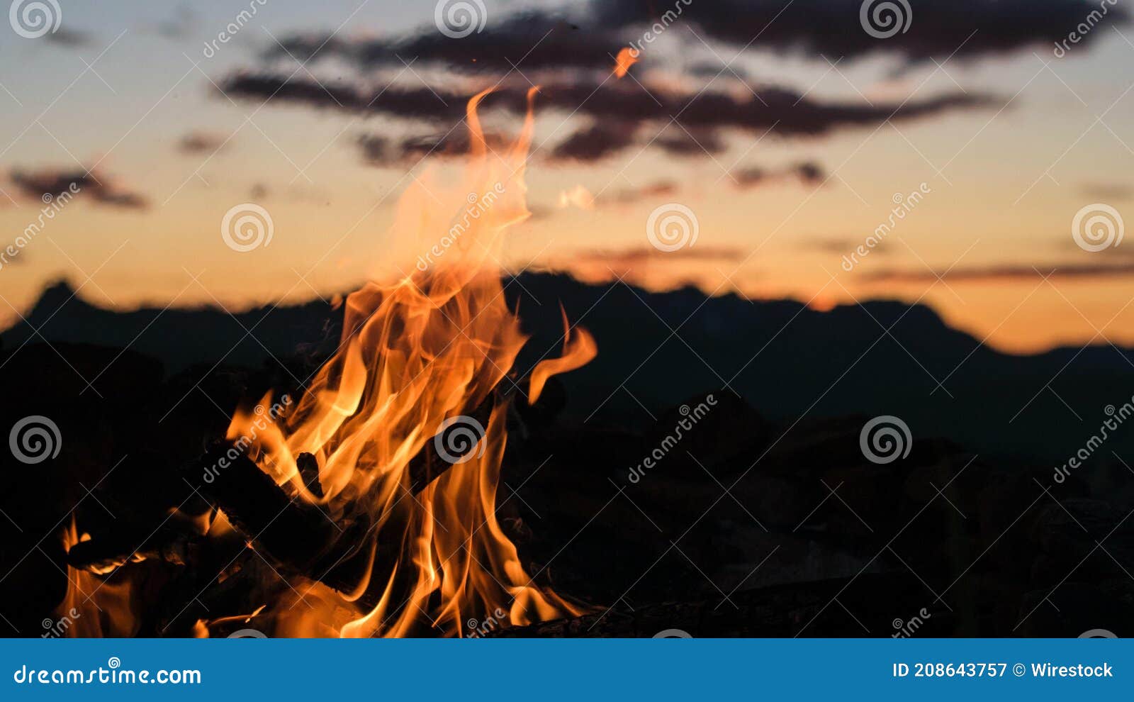 Closeup Shot of a Fire with Clouds in the Background Stock Image ...