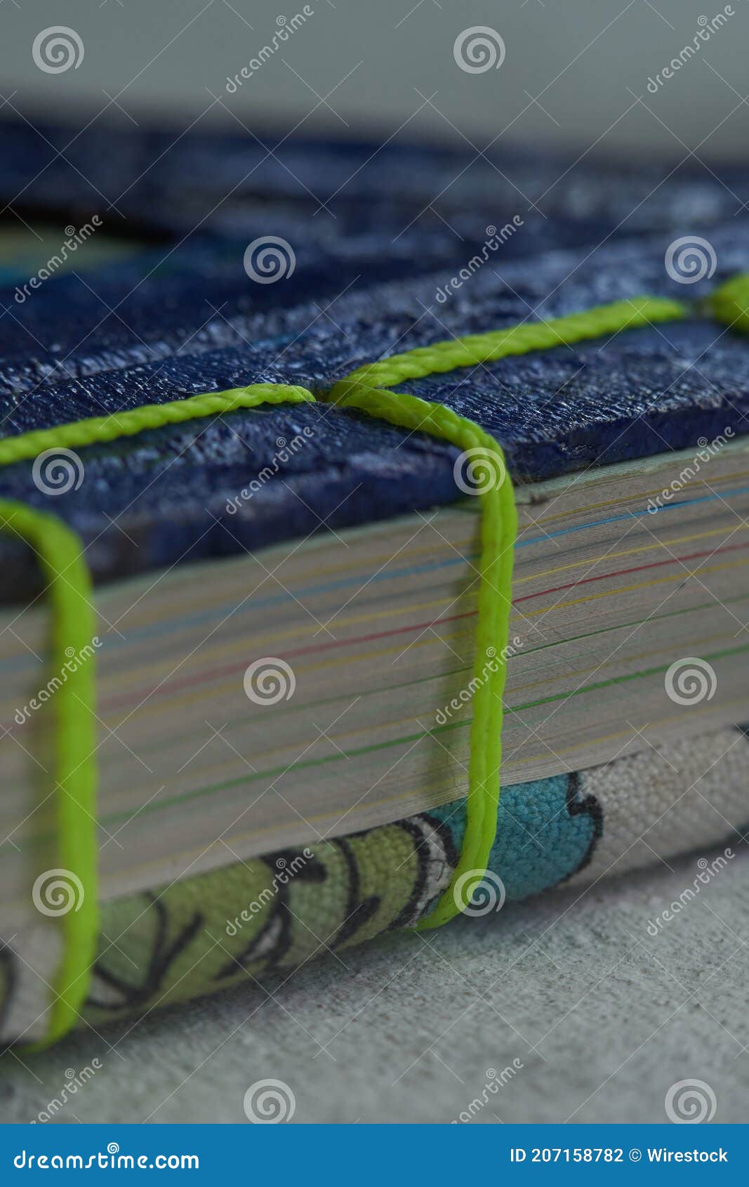 Closeup Shot of Folded Paper Sheets Bound with Green Thread Stock Photo ...