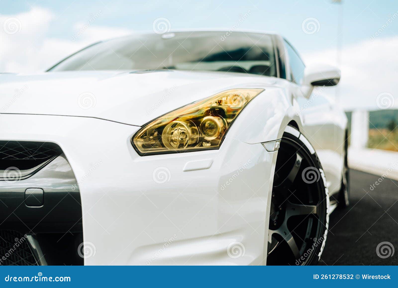 Closeup Shot of the Front and the Headlight of White Nissan Gtr in ...