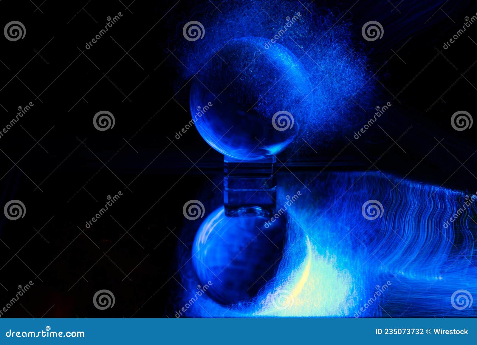 Closeup Shot of a Glowing Crystal Ball with Blue Lights on Dark ...