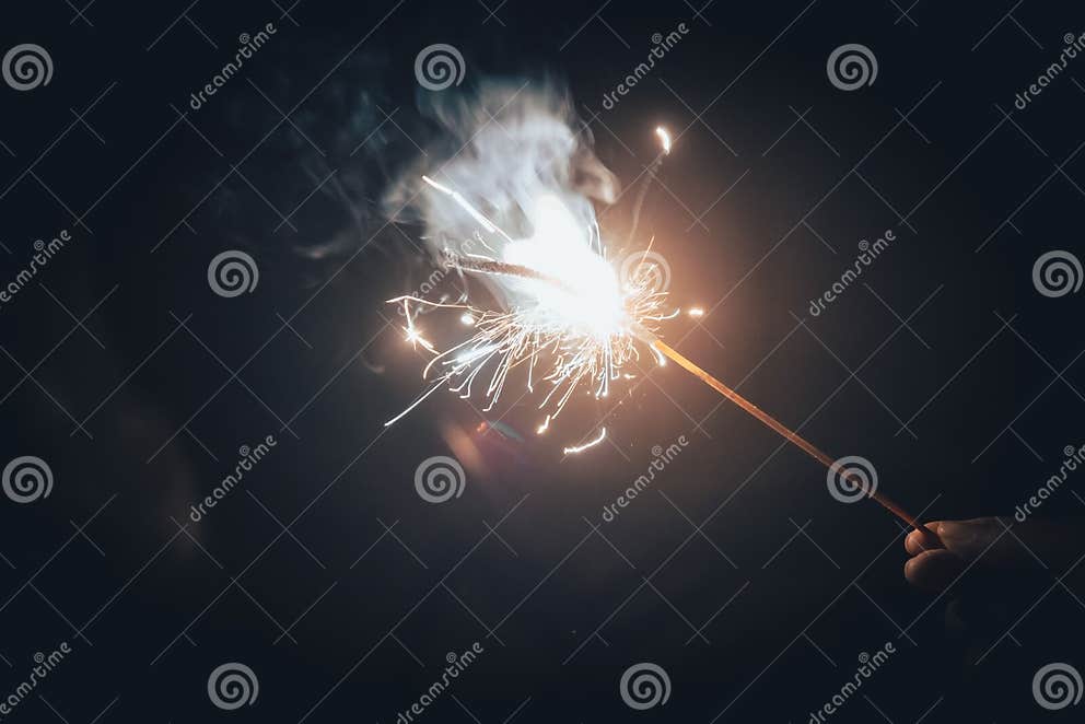 Closeup Shot of a Hand-held Firework Sparkler Stock Photo - Image of ...