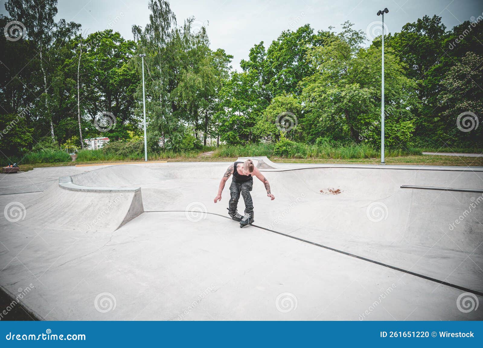 Closeup Shot of an Inline Skater in a Skating Rink Practicing Moves ...