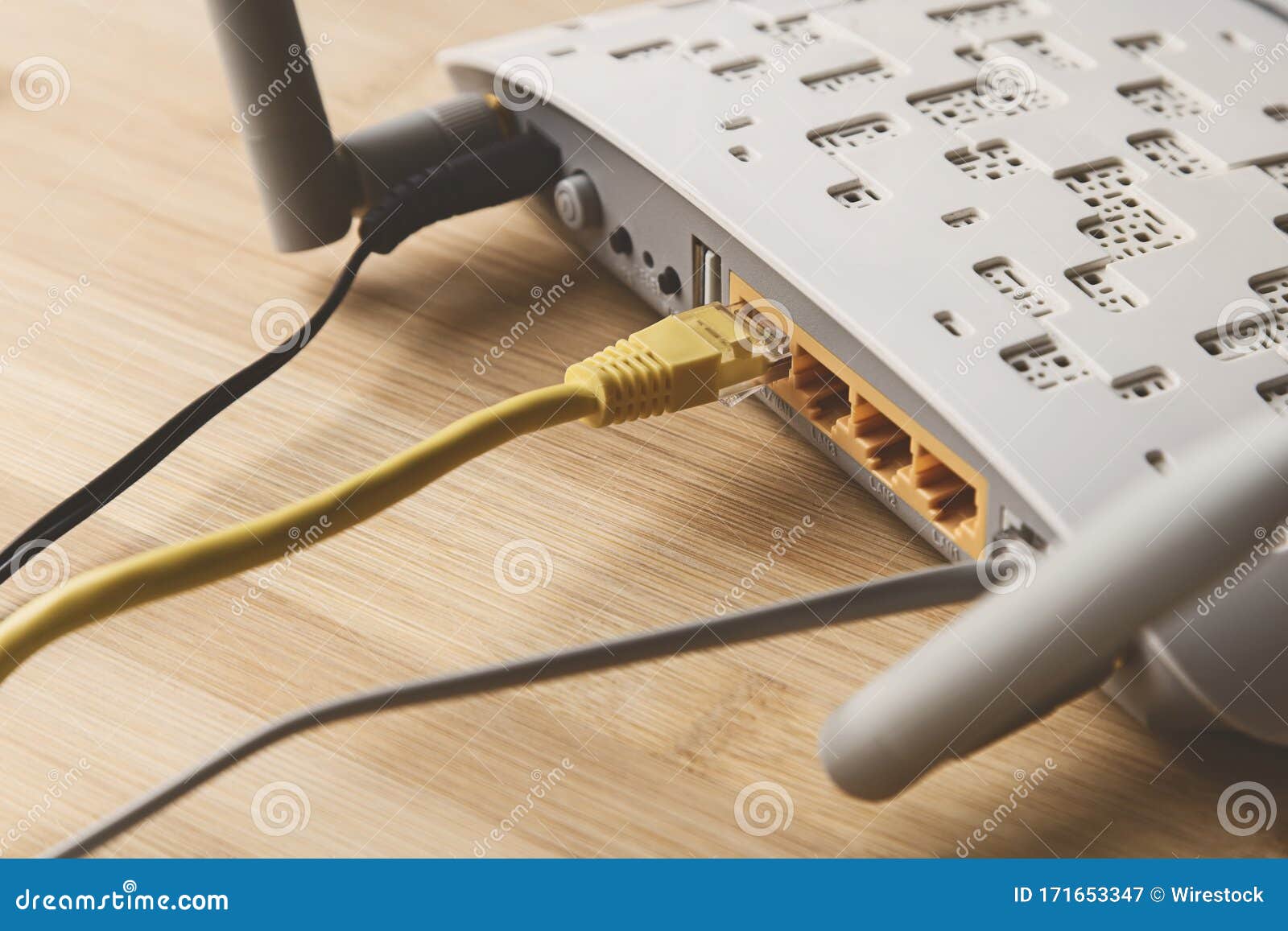 Closeup Shot of an Internet Modem with a Cable on a Wooden Surface ...