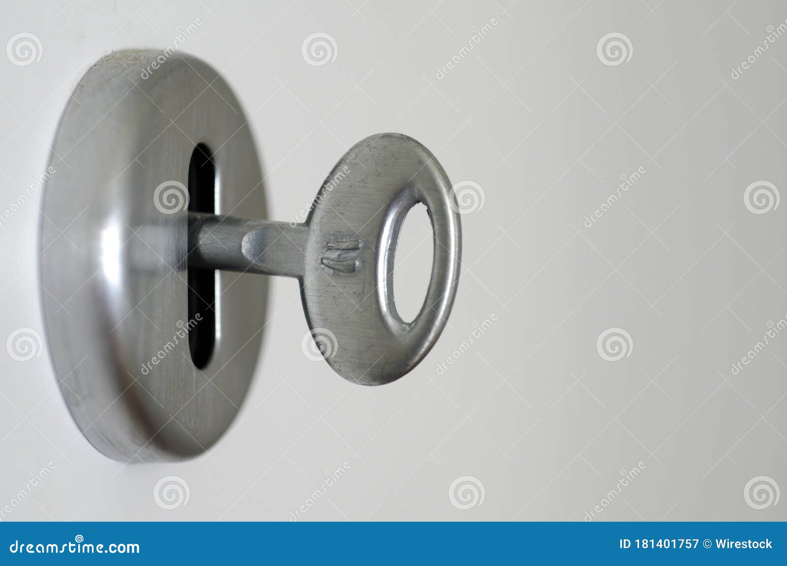 Closeup Shot of a Keyhole with a Key on the White Door Stock Image ...