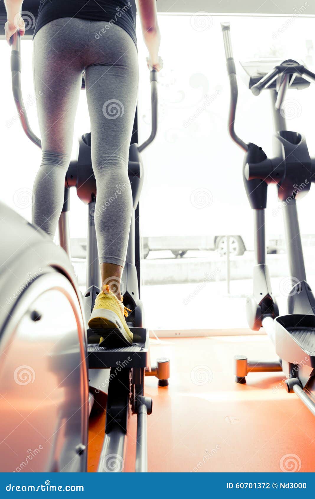 Closeup Shot of Legs of a Female Using Elliptical Trainer Stock Photo ...