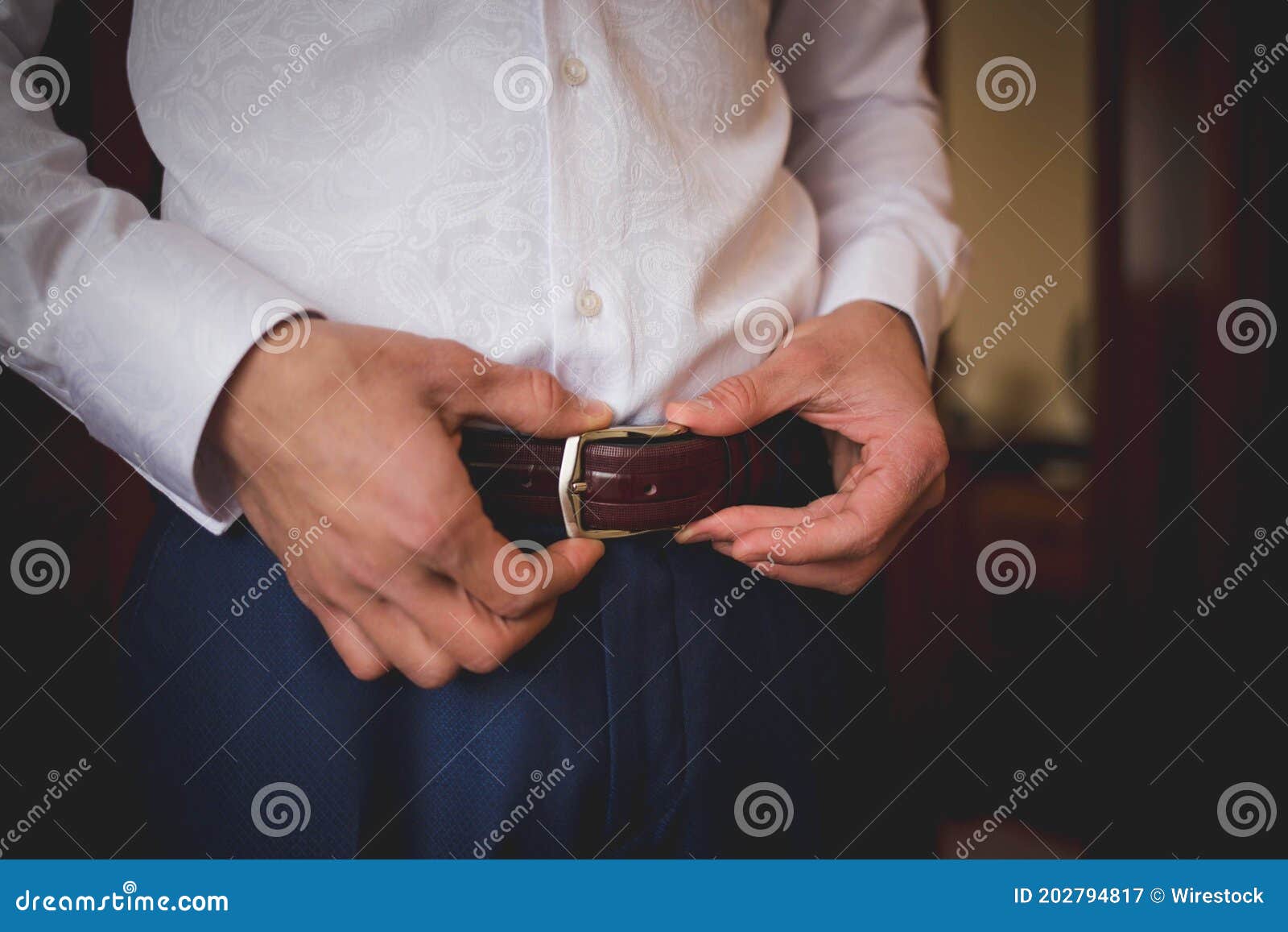 Closeup Shot of a Man Adjusting His Belt Stock Image - Image of adjust ...