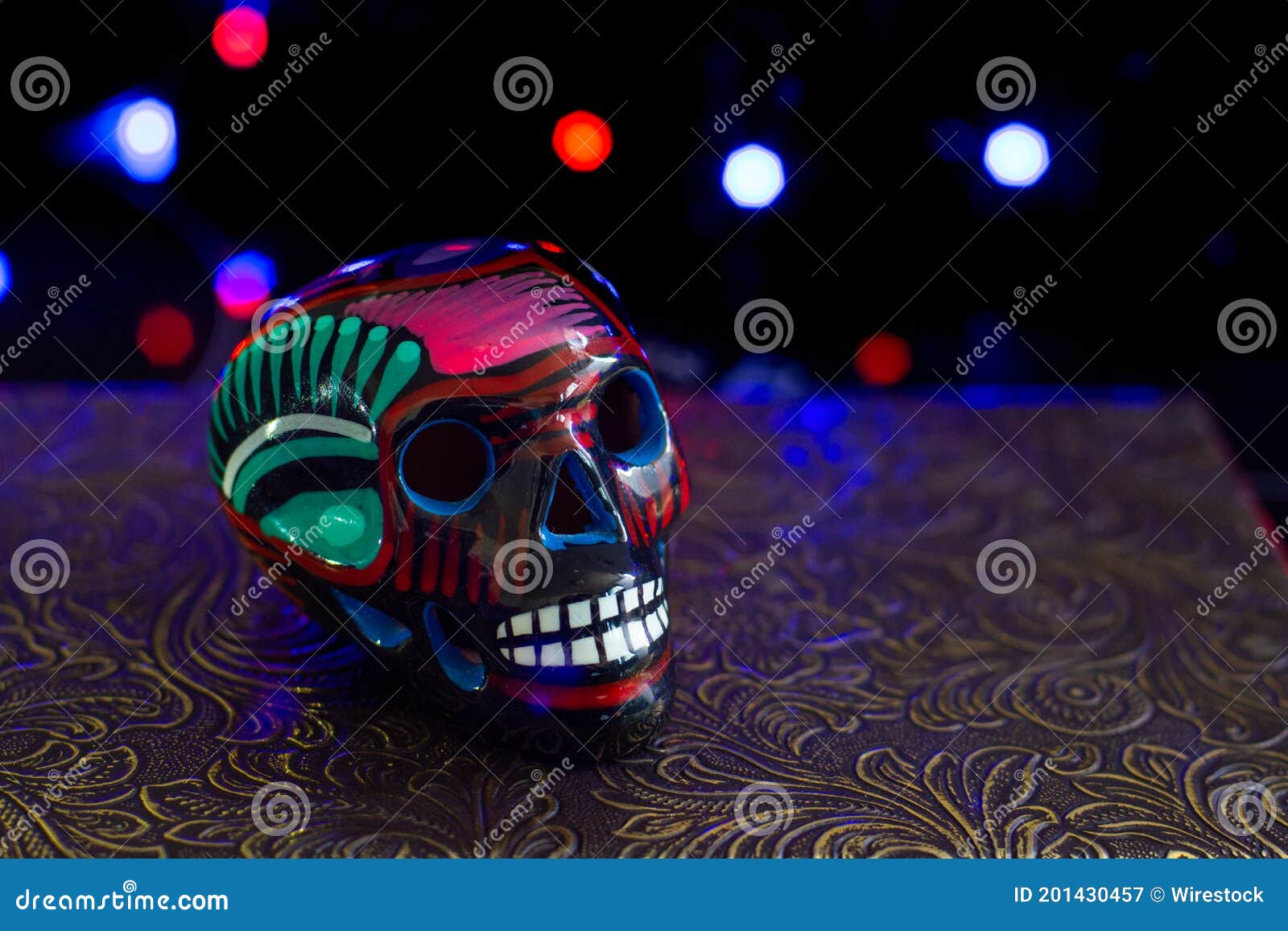 Closeup Shot of a Mexican Altar with a Skull and Aztec Figurines on ...