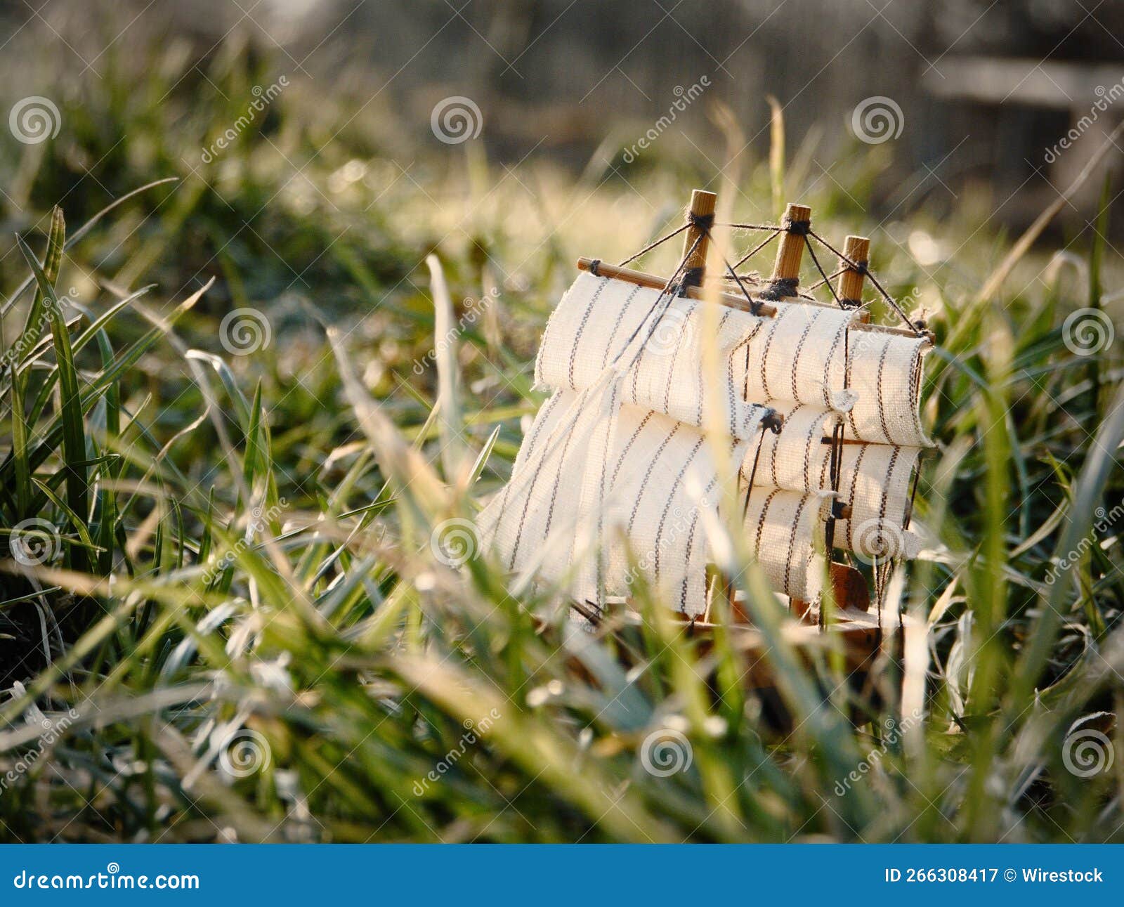 Closeup Shot of a Miniature Ship Sailing on the Grass. Stock Image ...