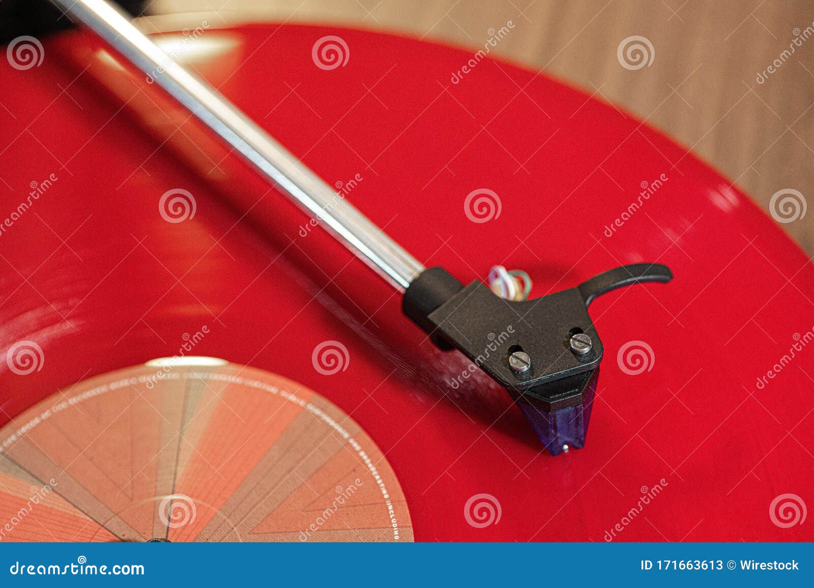 Closeup Shot of a Modern Gramophone with a Red Disc and Headshell in a ...