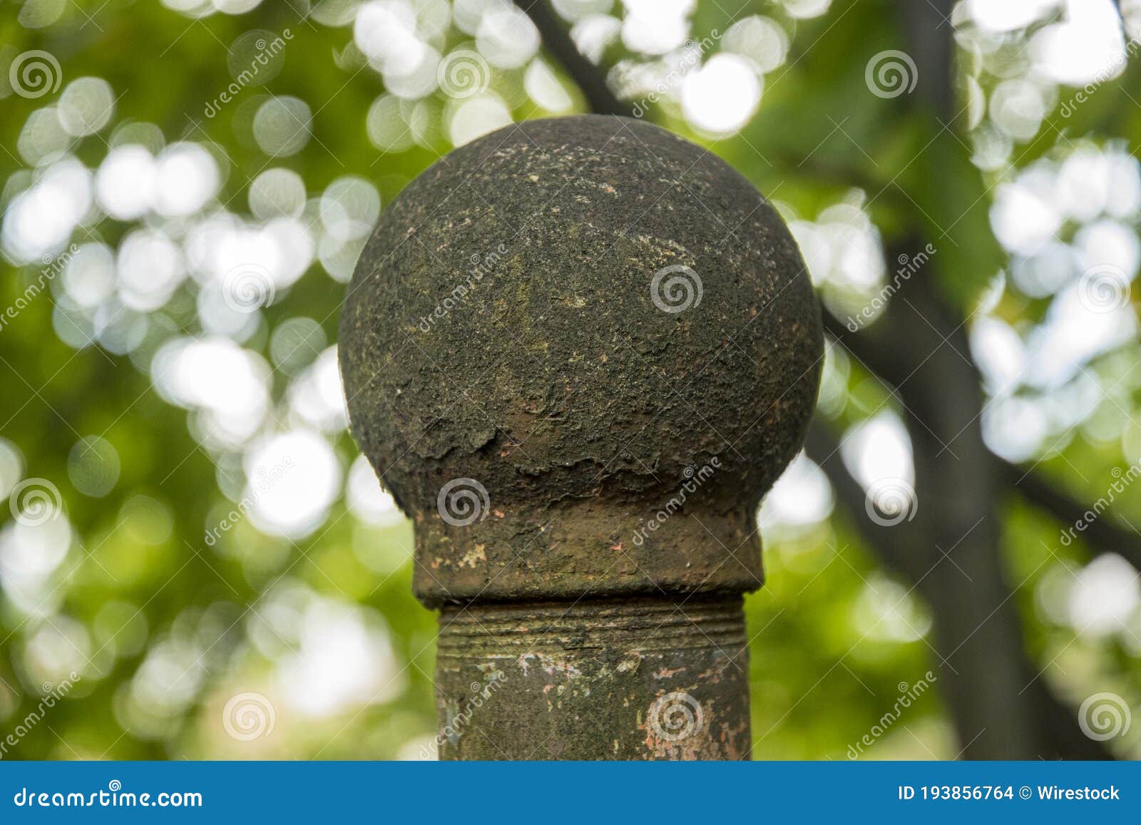 Closeup Shot of a Mossy Stone Round Column with White Bokeh Lights in ...