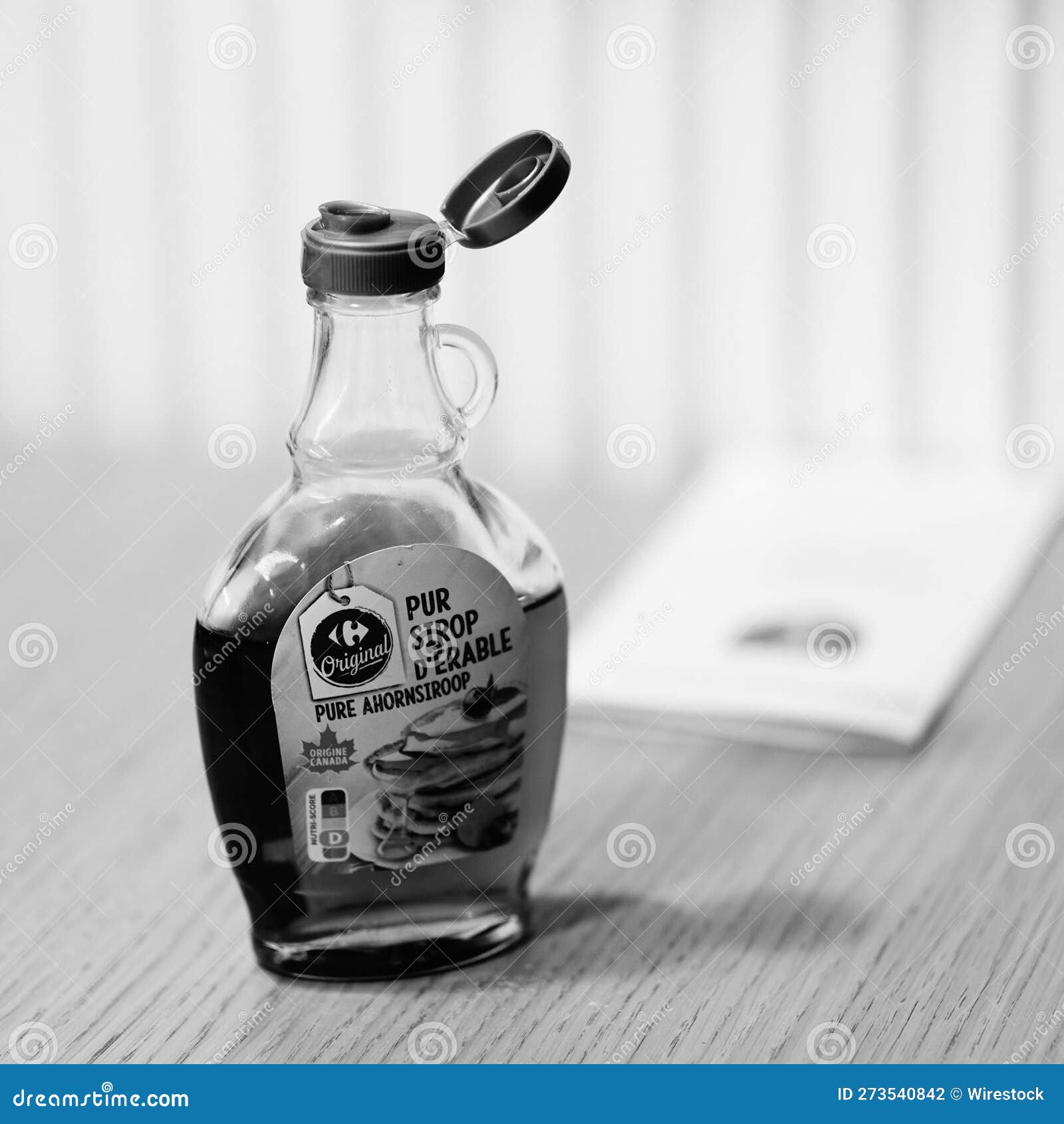 Closeup Shot of an Open Bottle of Maple Syrup on the Table. Editorial ...