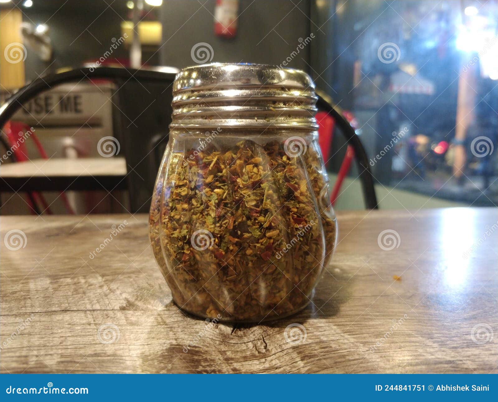 Closeup Shot of Oregano and Chilli Flakes on Table Stock Image - Image ...