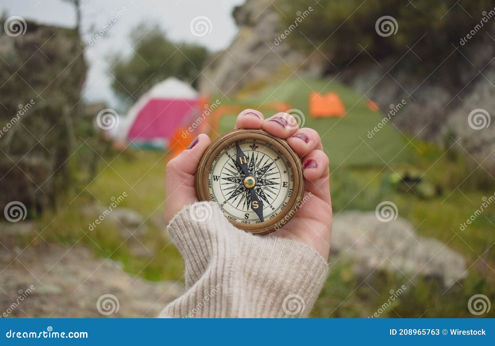 Closeup Shot of a Person Holding a Compass and Looking for Direction ...