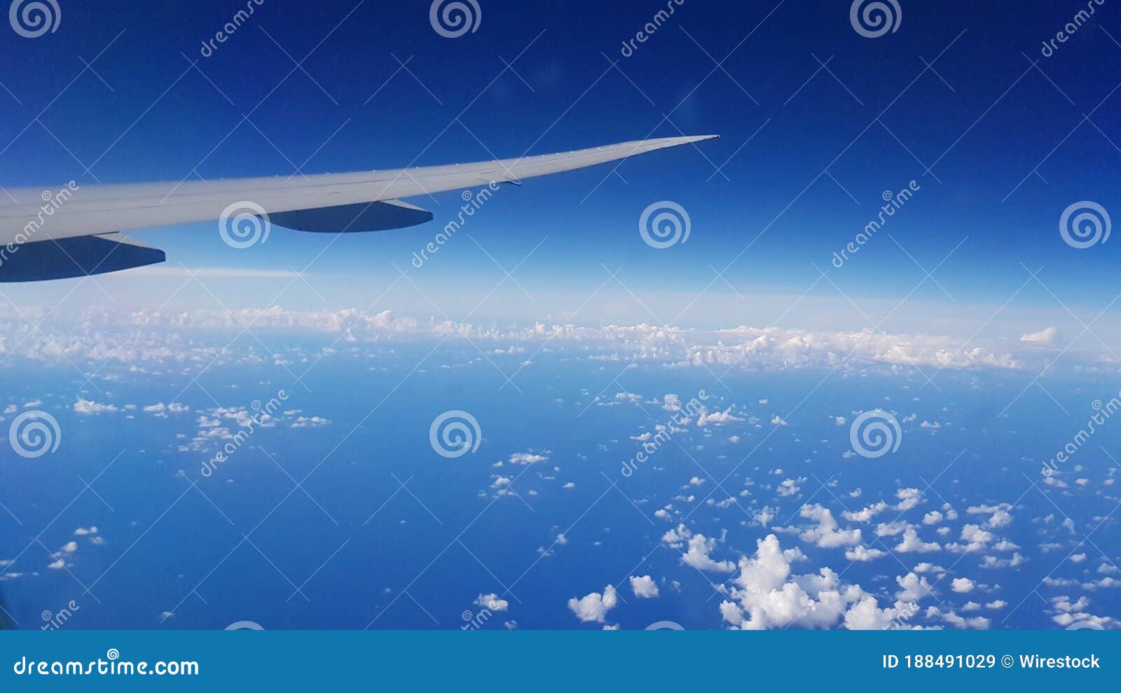 Closeup Shot of a Plane Wing in Flight Under Blue Sky Stock Image ...