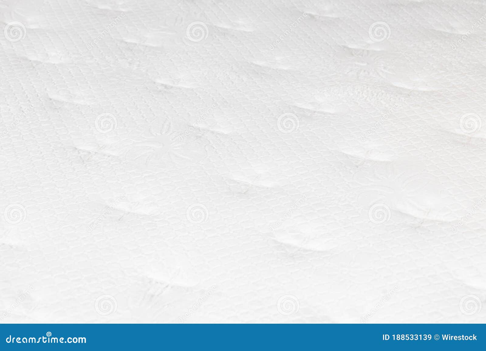 Closeup Shot of a Quilted White Mattress with Soft Flowers Pattern ...