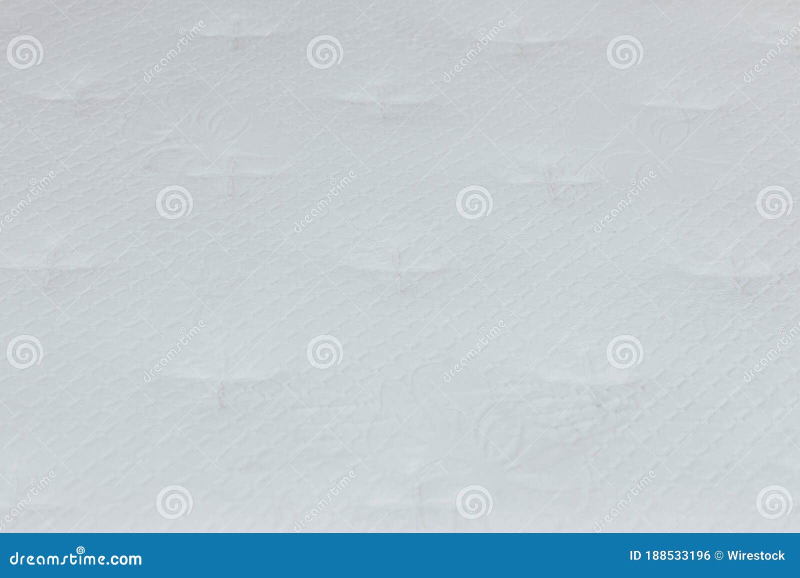 Closeup Shot of a Quilted White Mattress with Soft Flowers Pattern ...