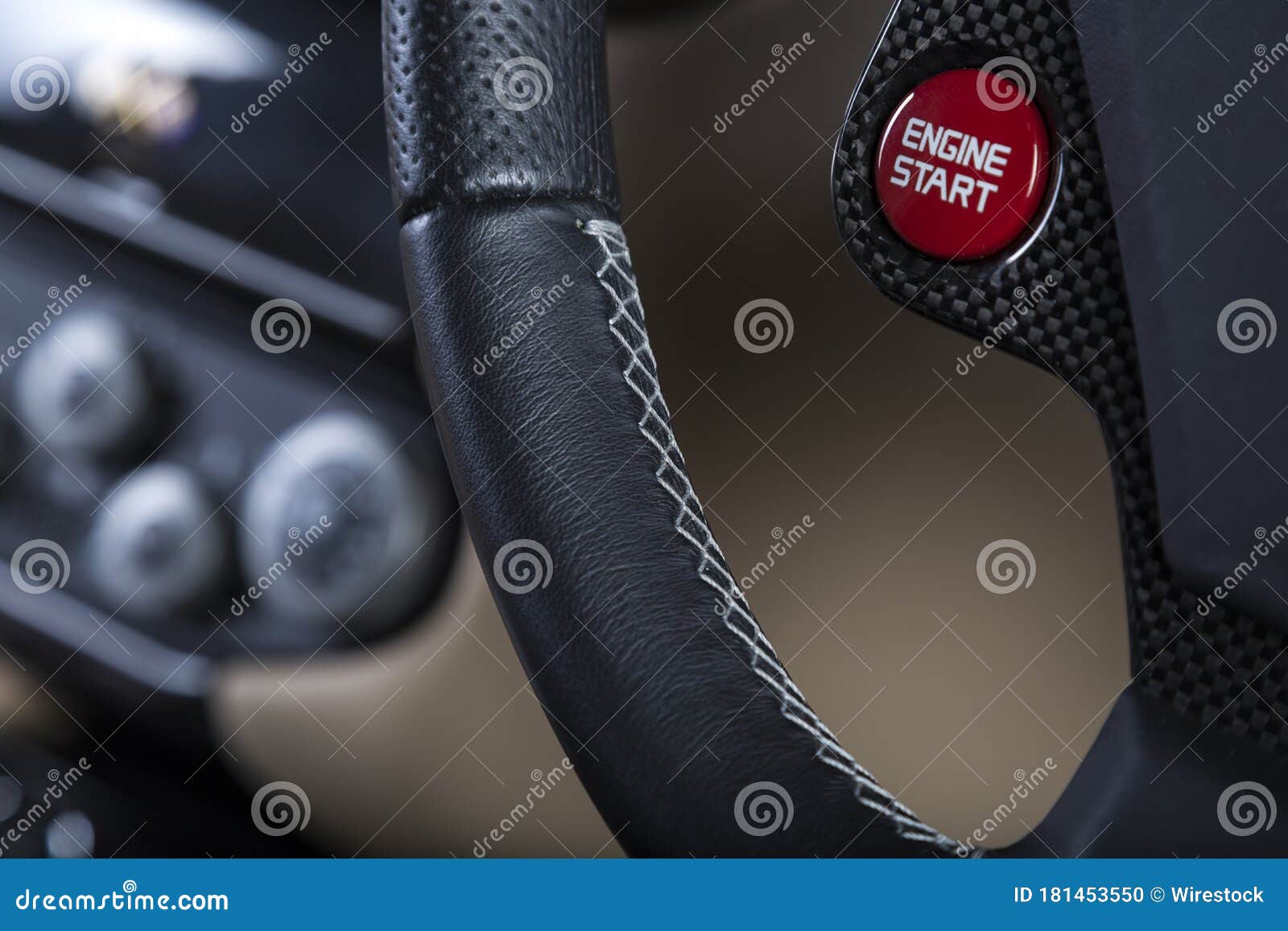 Closeup Shot of a Red Engine Start Button on the Steering Wheel of a ...