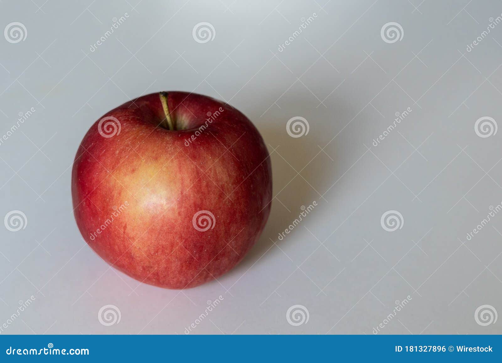 Closeup Shot of a Red Shiny Apple on a White Background Stock Photo ...