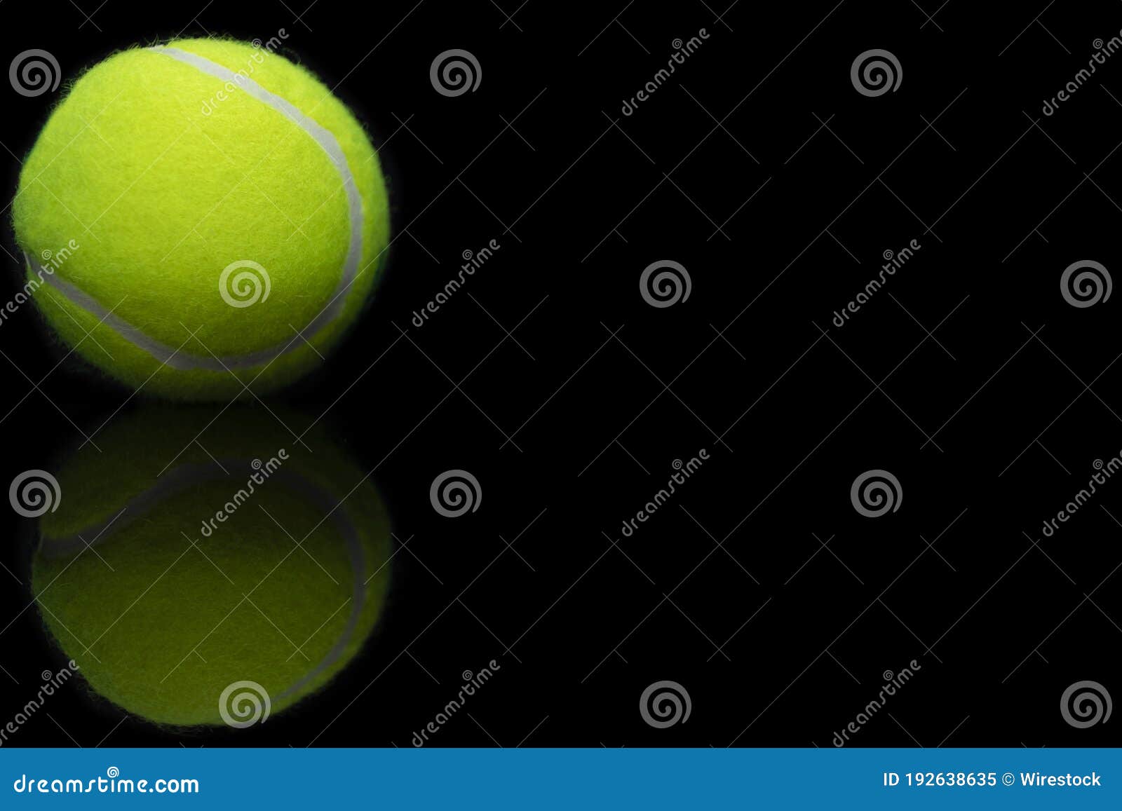 Closeup Shot of the Reflection of a Tennis Ball on a Reflective Black ...
