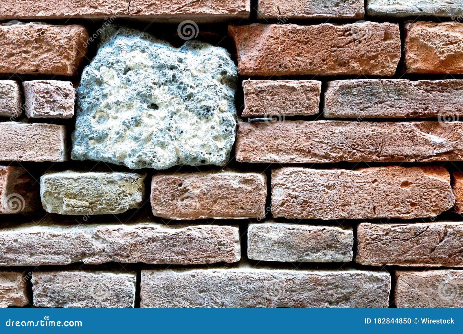 Closeup Shot of a Rock Embedded in a Brick Wall Stock Photo - Image of ...