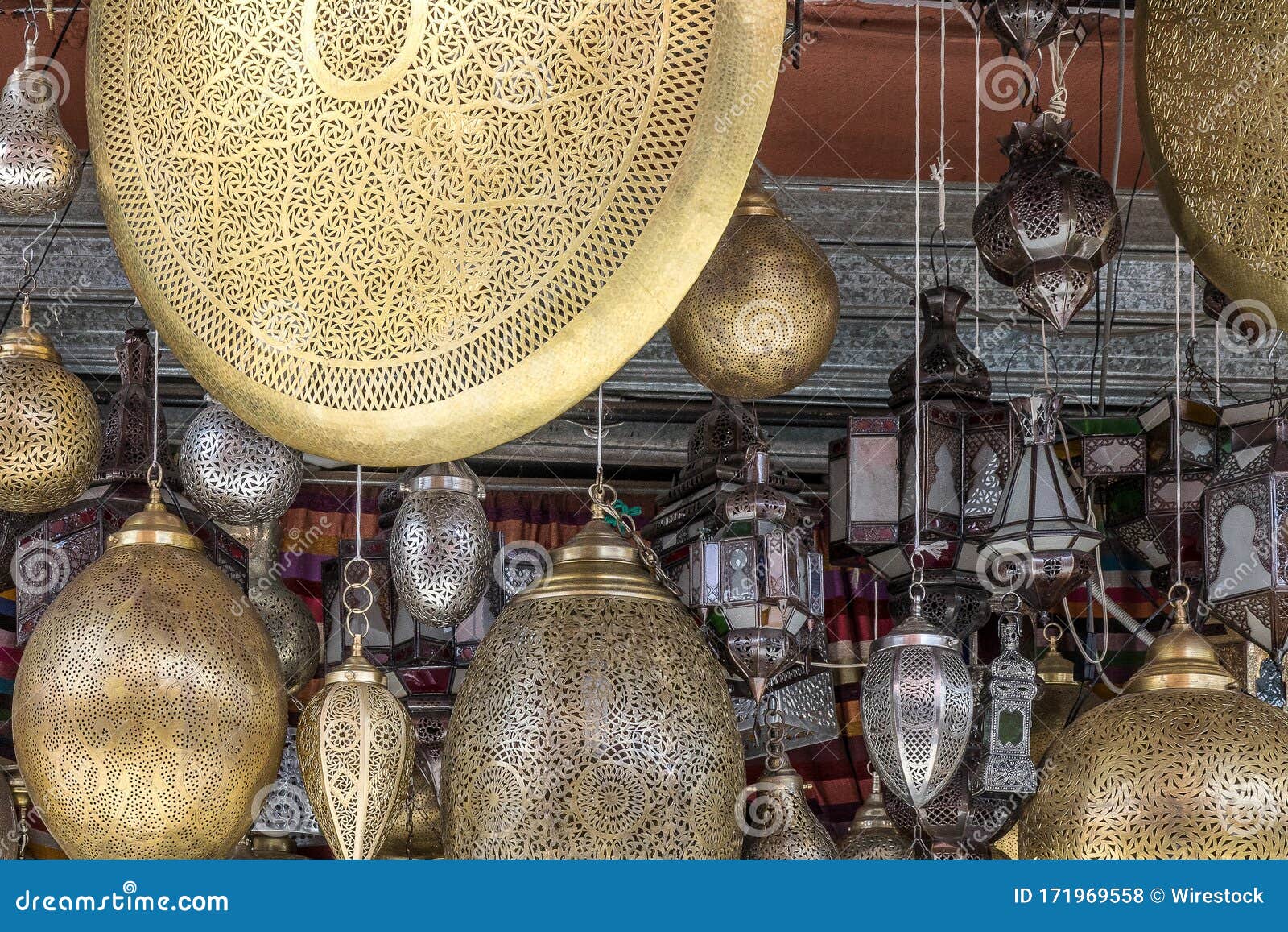 Closeup Shot of Several Metal Lamps and Patterned Objects Hanging from ...