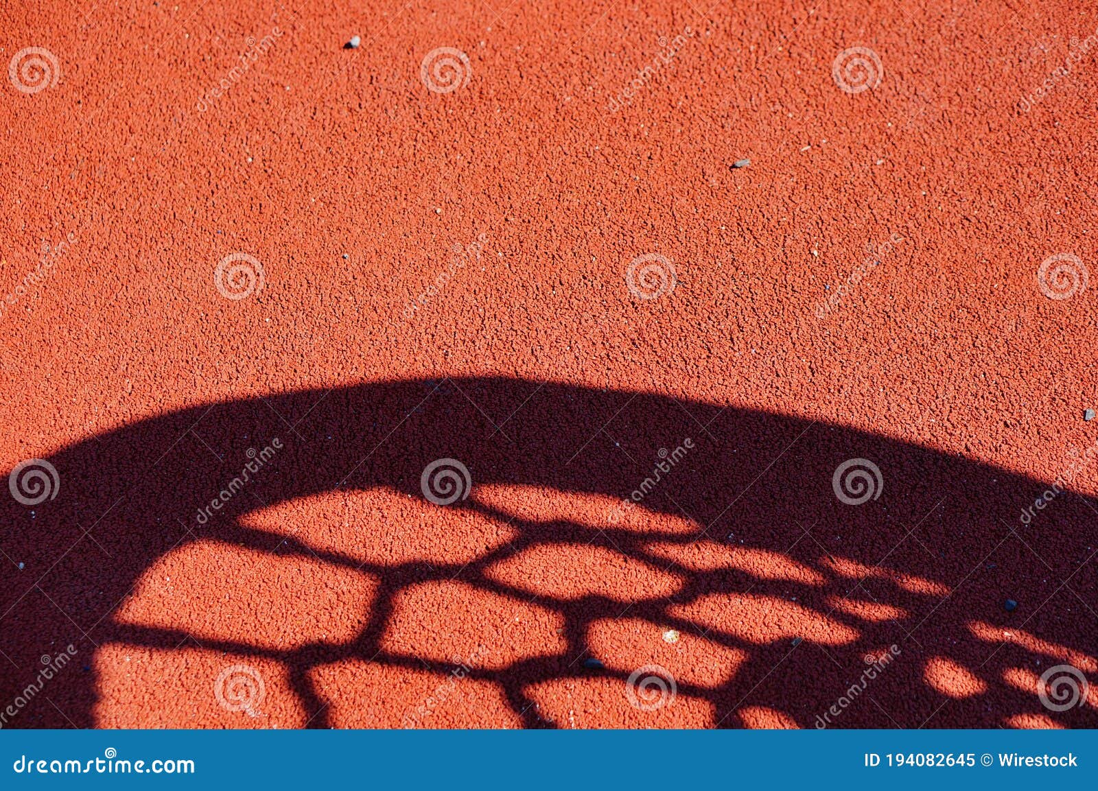 Closeup Shot of the Shadow of a Net Falling on a Red Surface Stock ...