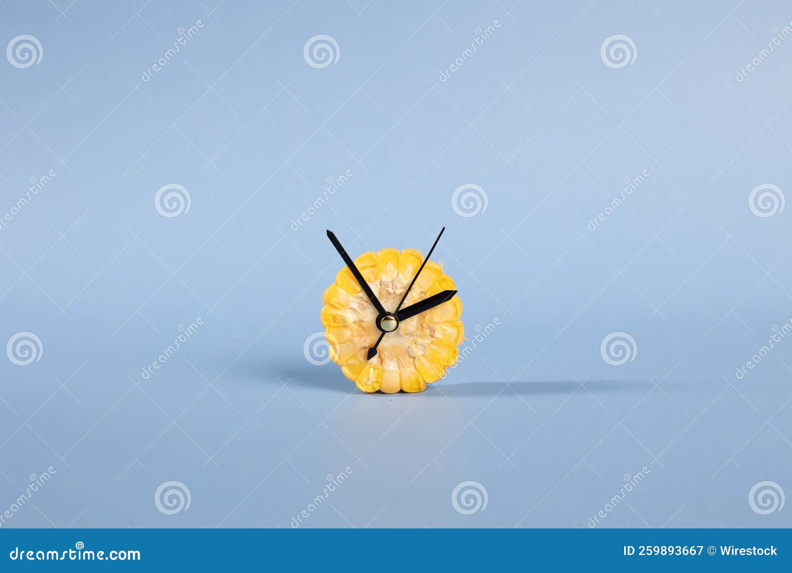 Closeup Shot of a Sliced Corn on the Cob Piece with Clock Hands on a ...