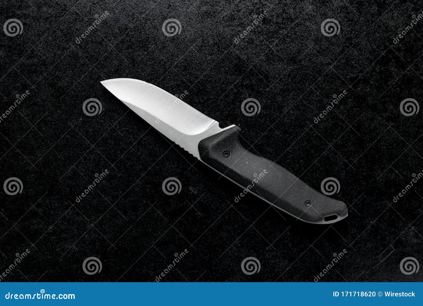 Closeup Shot of a Small Sharp Knife with a Black Handle on a Black ...