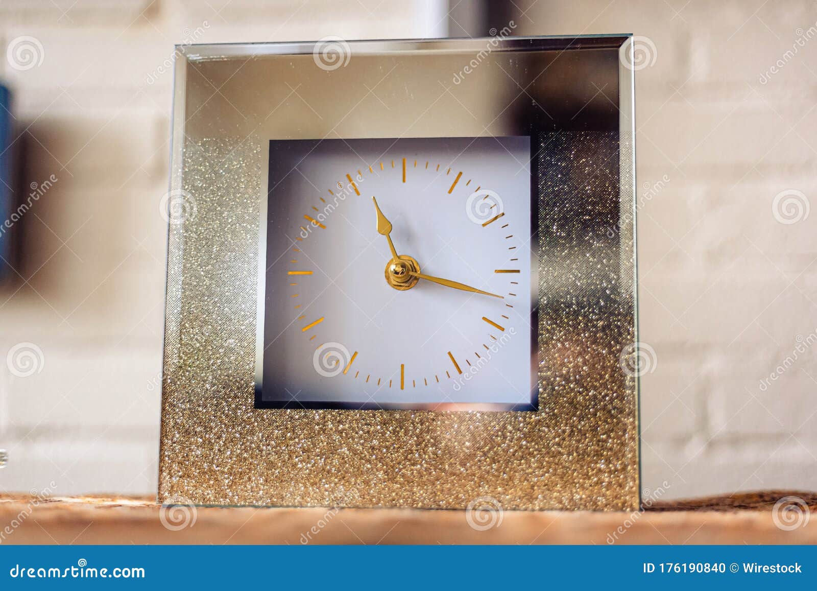 Closeup Shot of a Square-shaped Clock with Golden Arrows Stock Photo ...