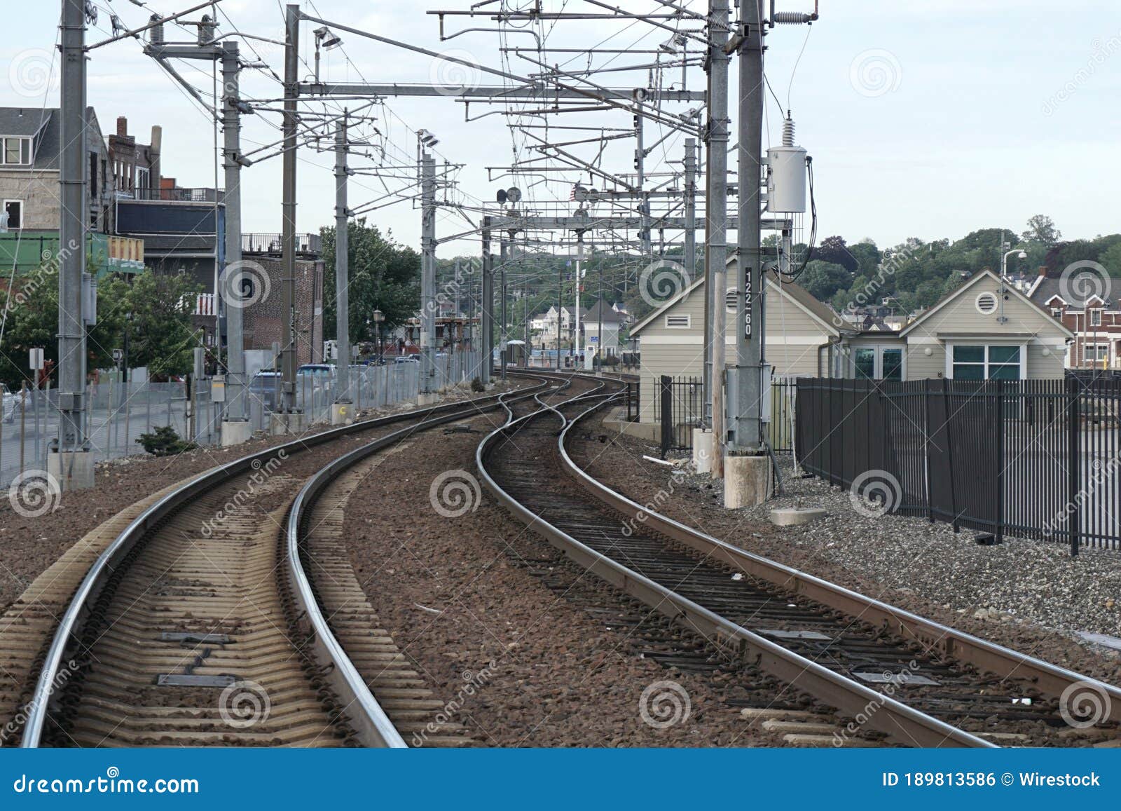 Closeup Shot of Train Railings in the Middle of the Town Surrounded by ...