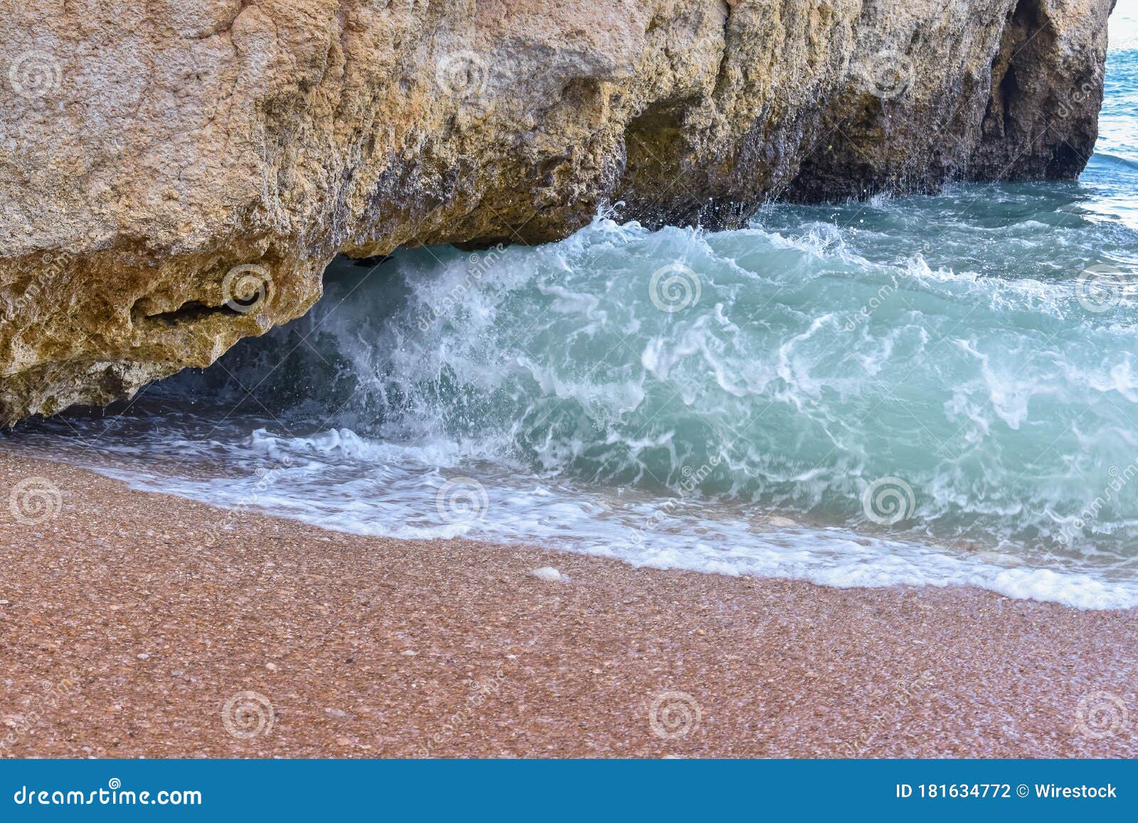 Closeup Shot of the Waves of the Ocean Under the Cliff Stock Photo ...