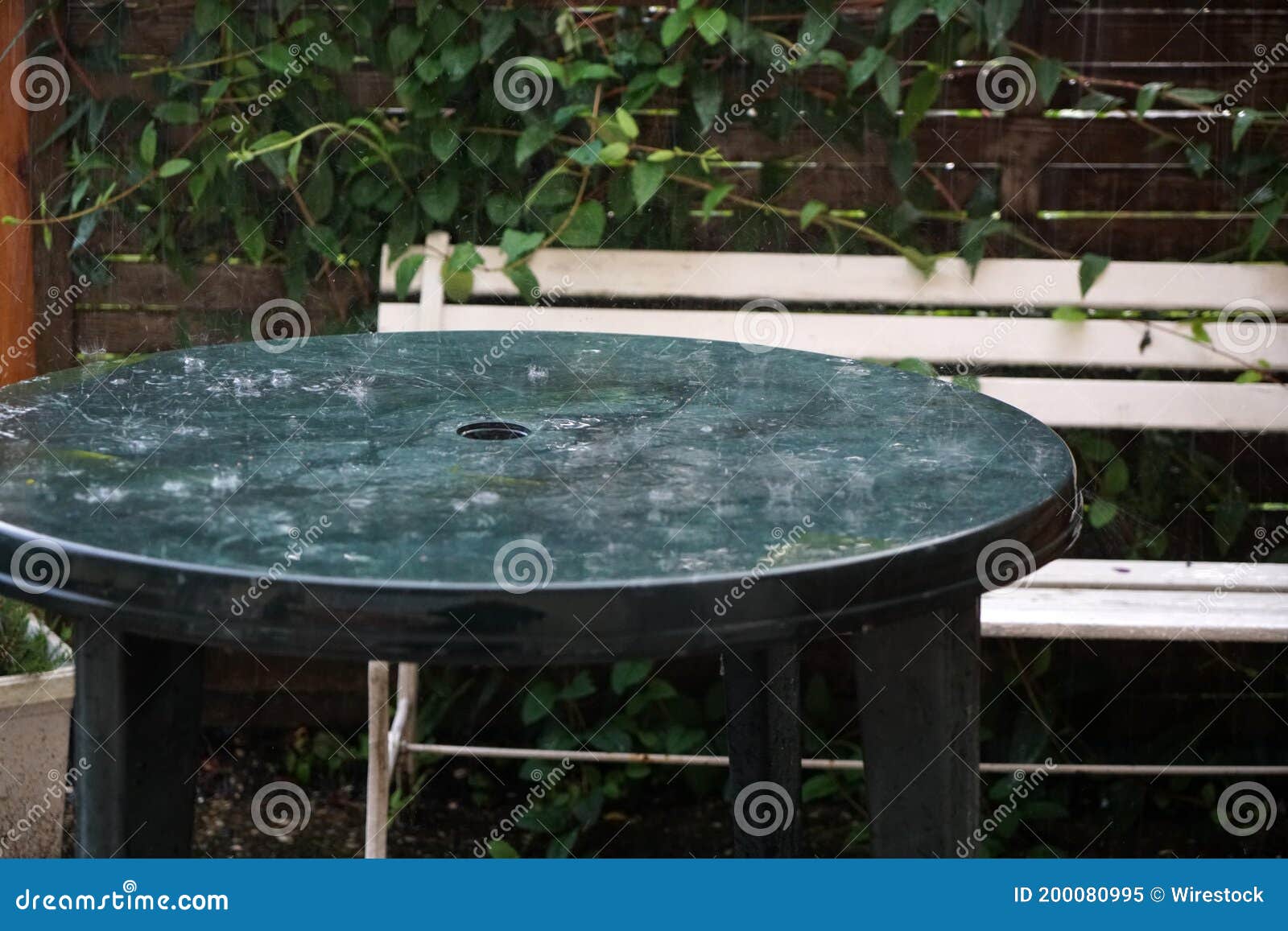 Closeup Shot of a Wet Table and a Bench Under the Rain Stock Image ...