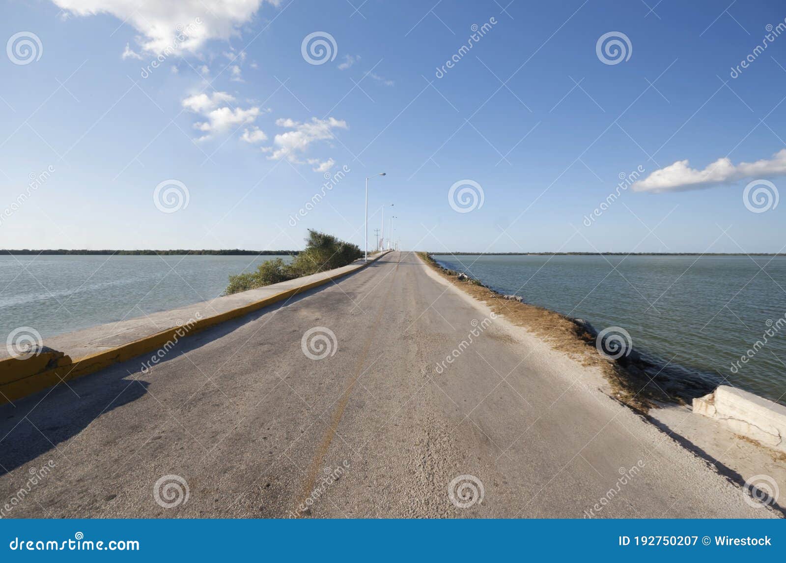 Closeup Shot of a Wide Empty Road with Sea in the Background Stock ...