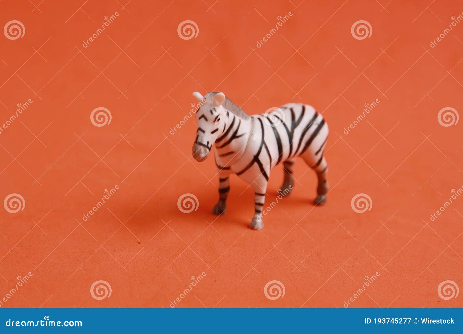 Closeup Shot of Zebra Shaped Plastic Toy Isolated on an Orange ...