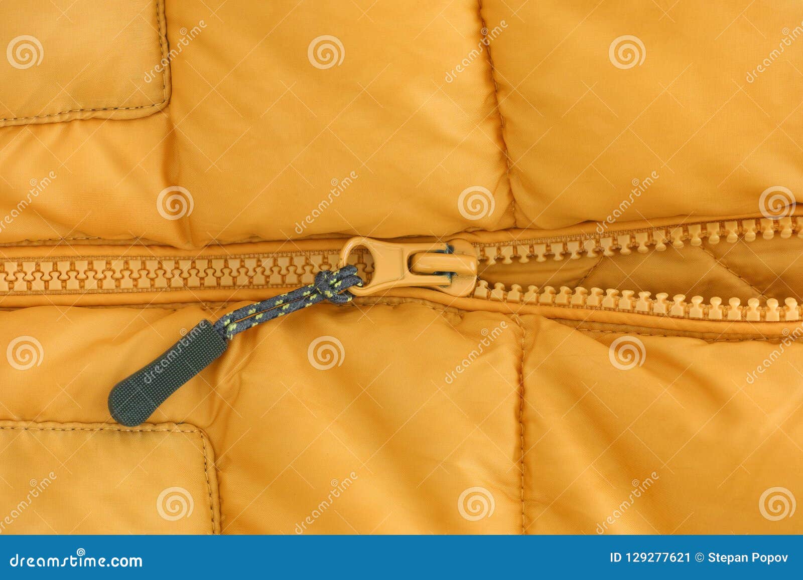 Closeup Shot of a Zipper on a Yellow Jacket Stock Image - Image of ...