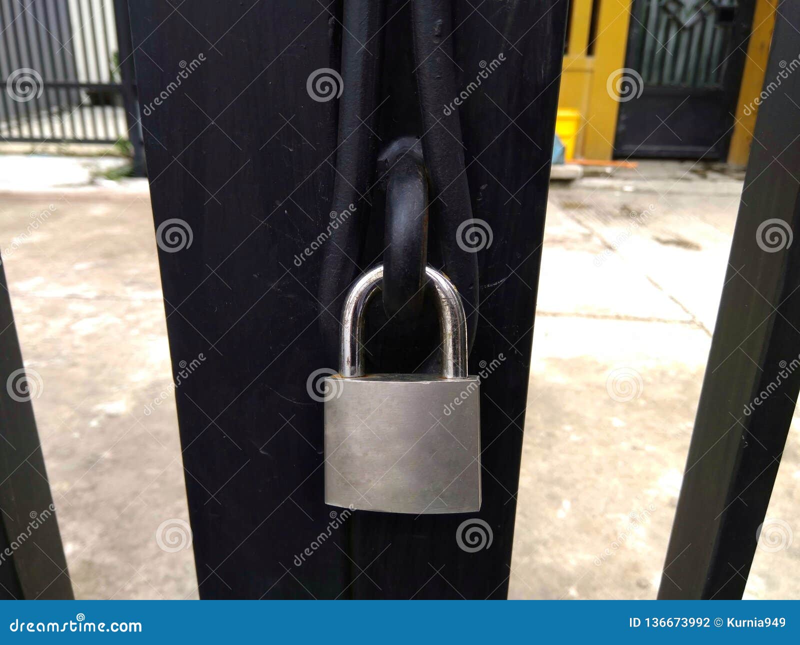 Silver padlock on a gate stock photo. Image of security - 136673992