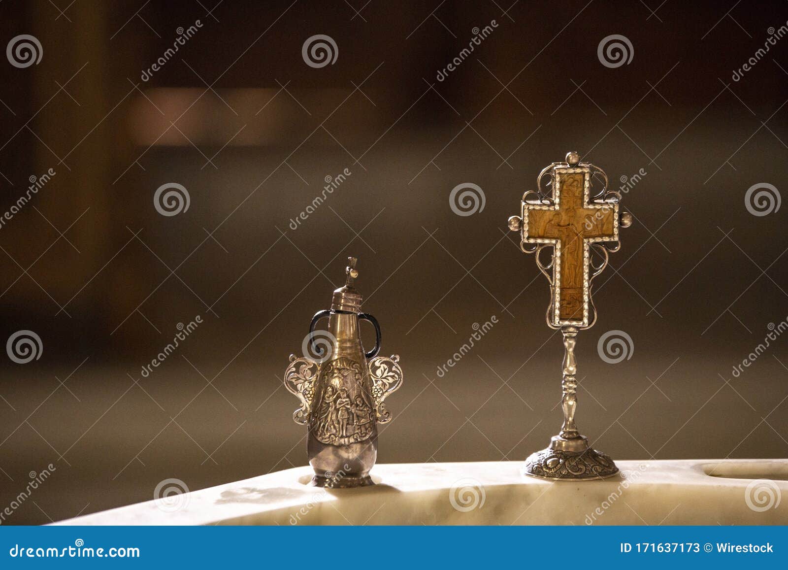 Closeup of a Small Cross with Engravings on it Under the Lights with a ...