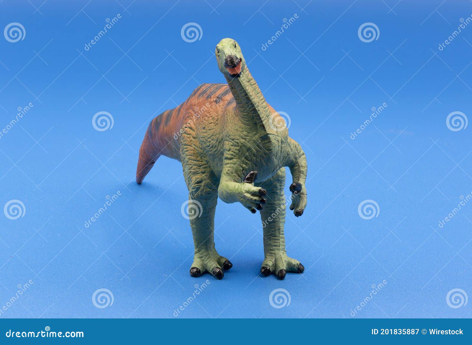 Closeup of a Small Model Brachiosaurus, on a Blue Background Stock ...
